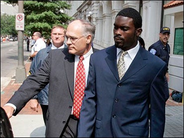 Michael Vick Surrenders, Taken To Jail - CBS News