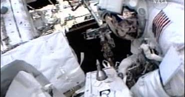 Astronauts Complete First Spacewalk - CBS News