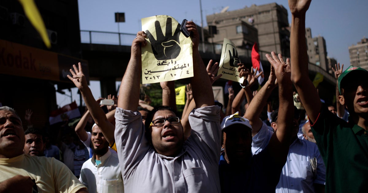 Egyptian riot police fire tear gas at protesters - CBS News