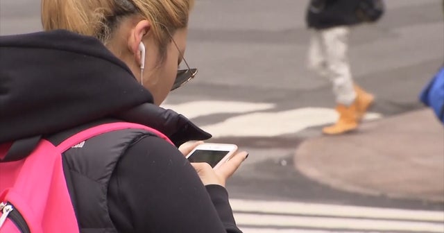 The dangers of walking while texting and talking - CBS News