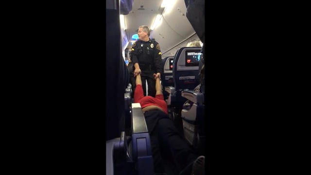 Watch Woman Dragged Off Delta Flight By Police In Detroit Cbs News