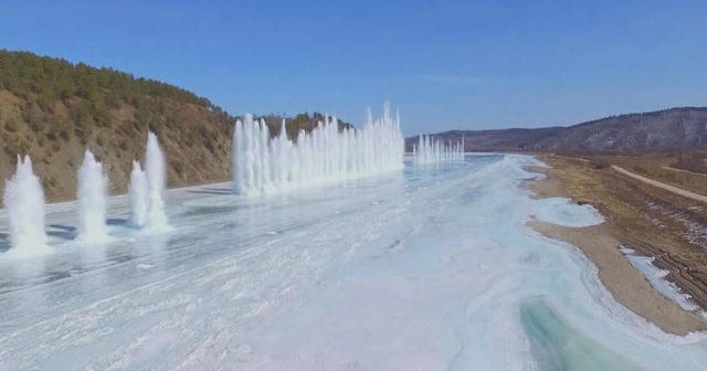 Explosion under frozen river creates awe-inspiring sight - CBS News