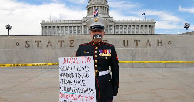 Marine holds silent protest outside Utah State Capitol - CBS News