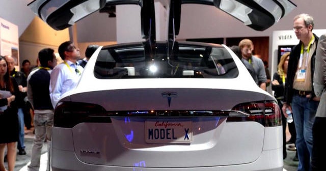 Should Apple buy Tesla? - CBS News