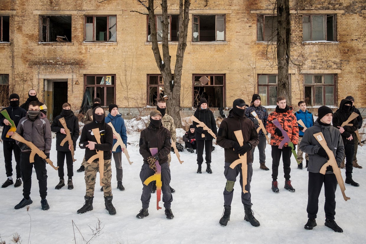 As Russia sends mixed signals, Ukrainian civilians train for war - CBS News
